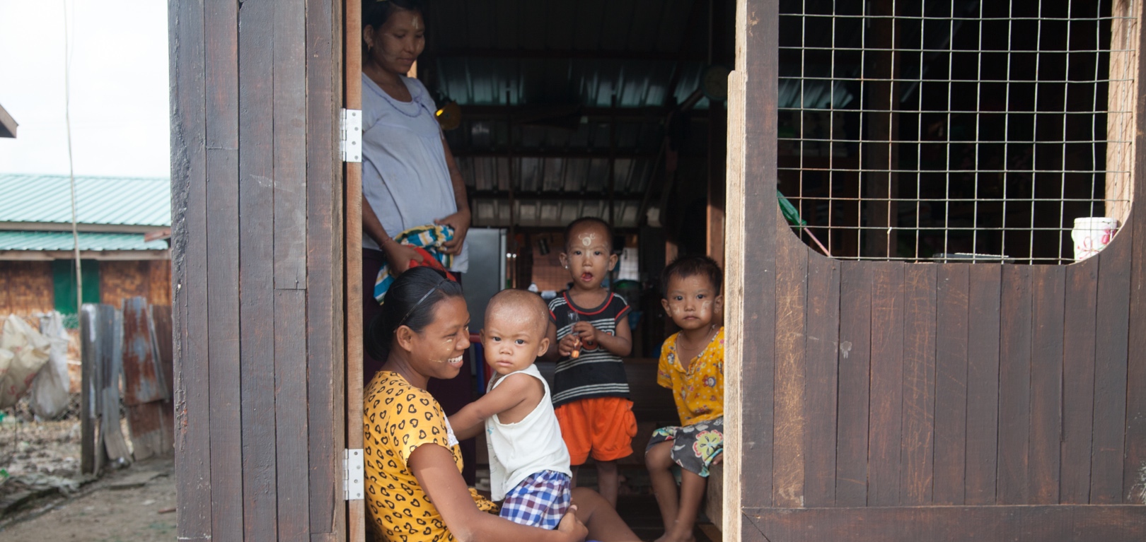 A family at Myaing Thar Yar resettlement village from the SEZ, Thilawa ...